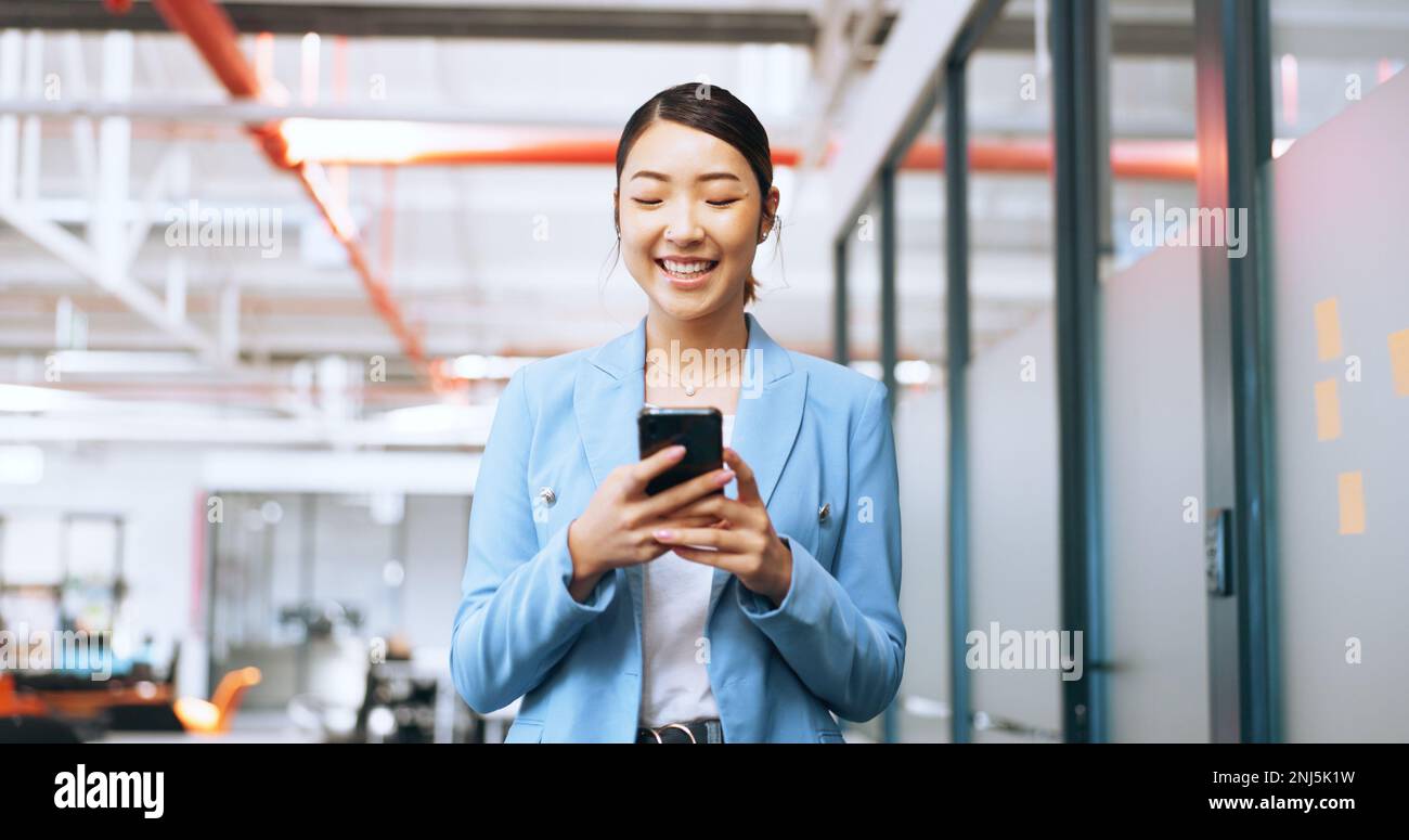 Asian woman, modern office and smartphone for connectivity, social ...