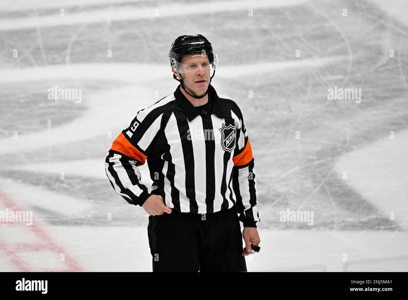 NHL referee Gord Dwyer (19) announces a penalty during an NHL hockey ...