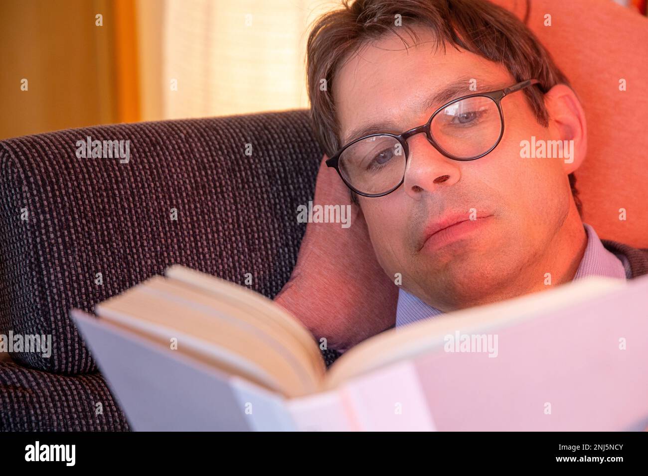 Man reading (symbol image, model released Stock Photo - Alamy