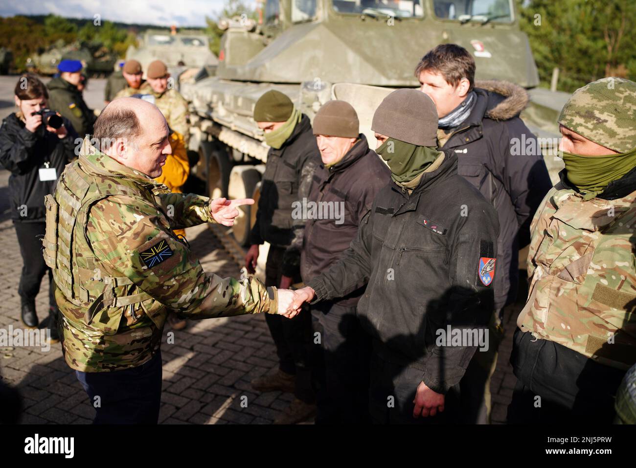 Britain's Defence Secretary Ben Wallace, left, visits Bovington Camp, a ...
