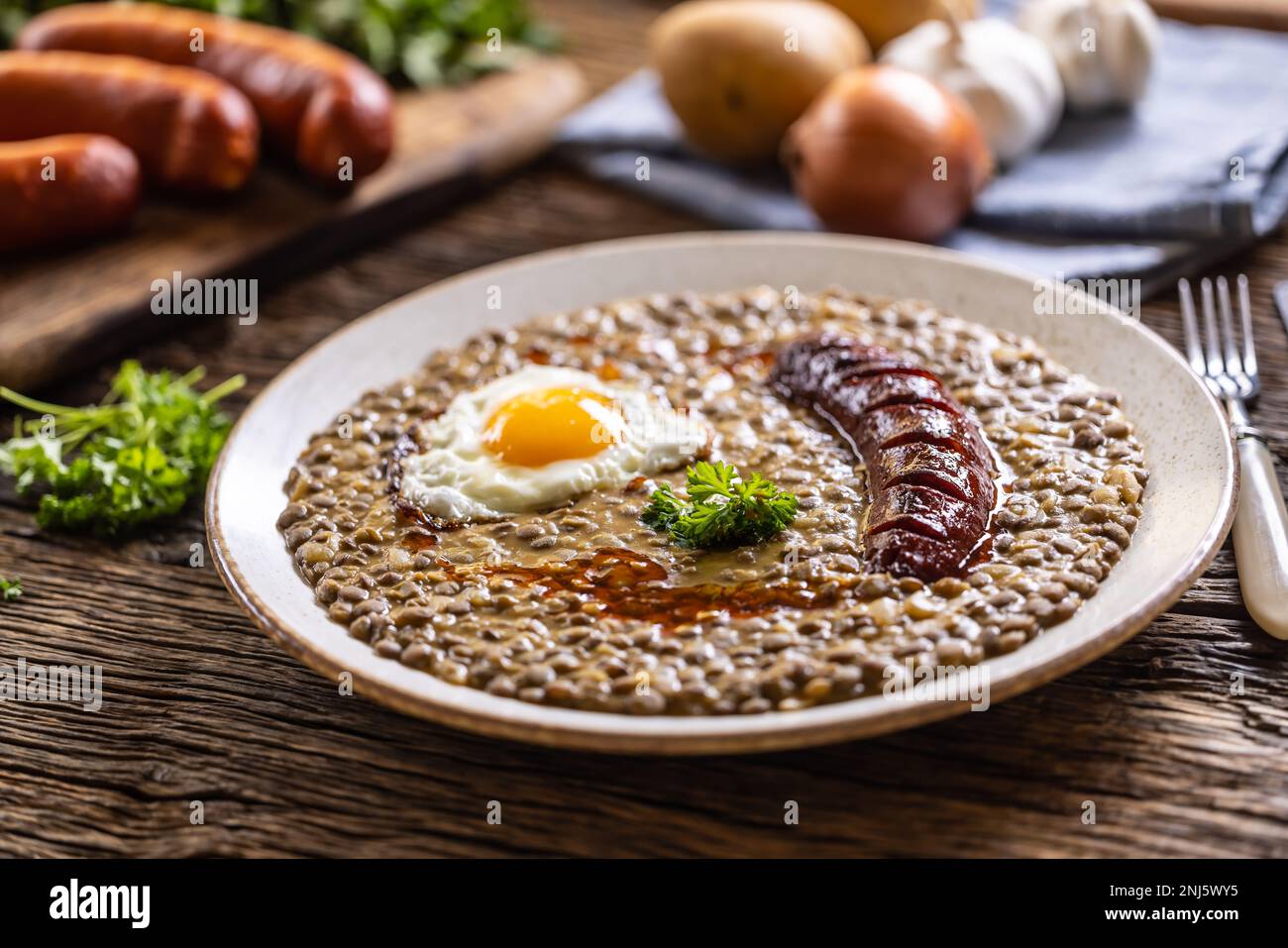 Lentil stew with baked sausageand egg, traditional Slovak food Stock ...