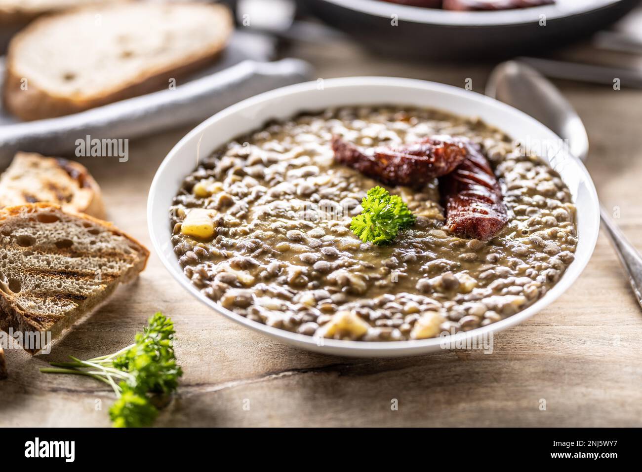 Lentil stew or soup with baked sausage, traditional Slovak food Stock ...