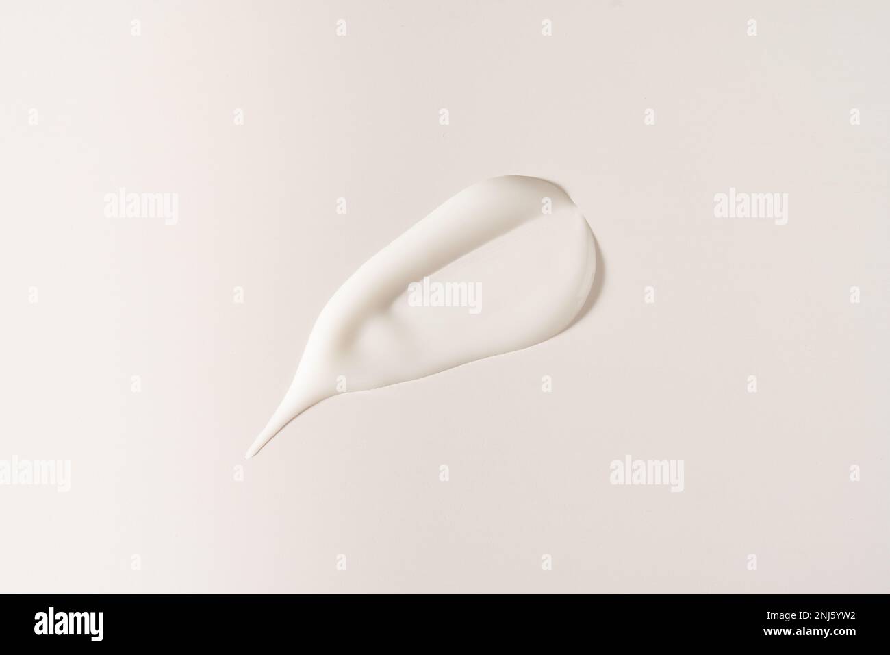 A smear of cosmetic cream. A white creamy drop of skin care cream ...