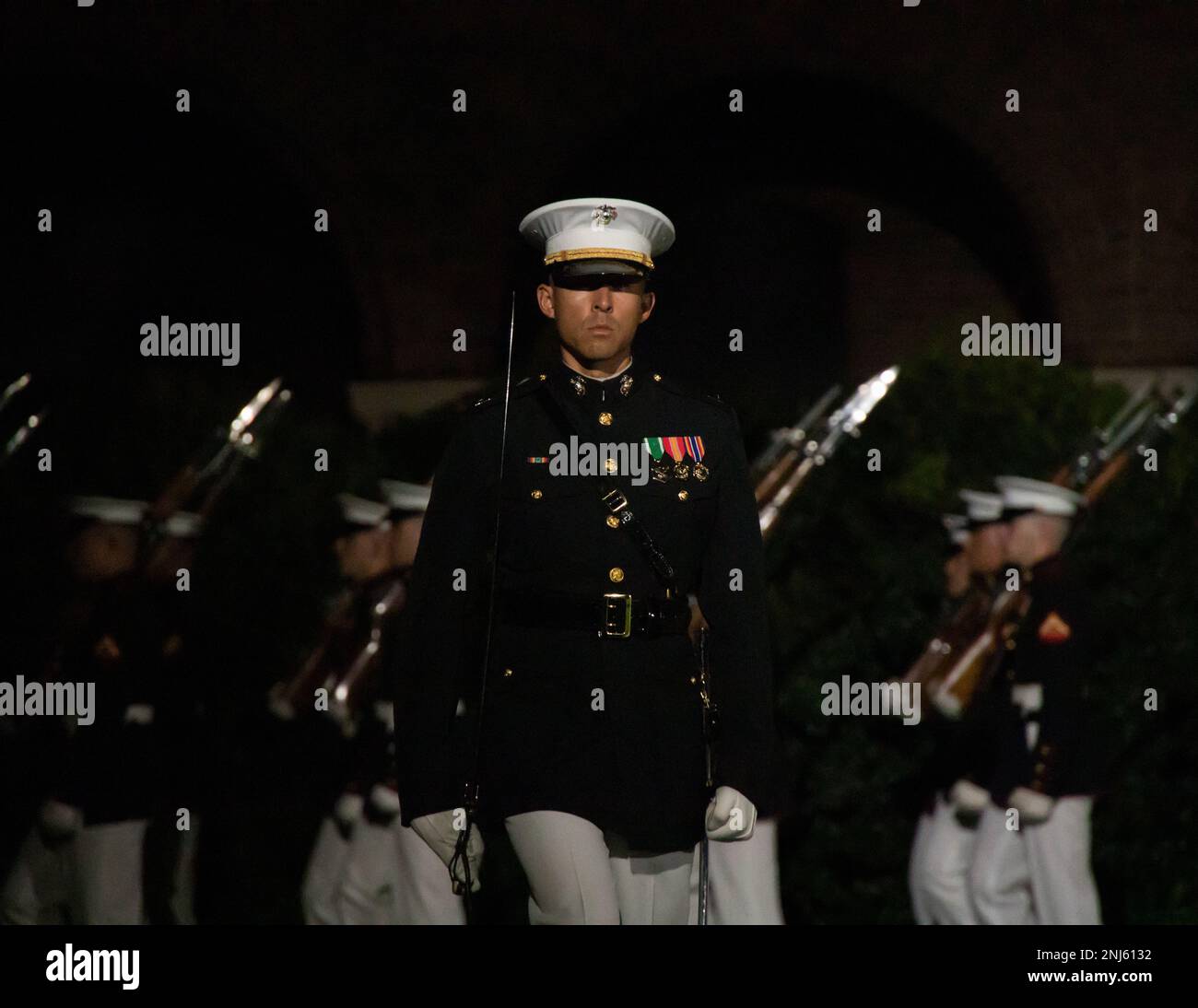 Capt. Brandon R. Lin, platoon commander, Alpha Company, marches during ...
