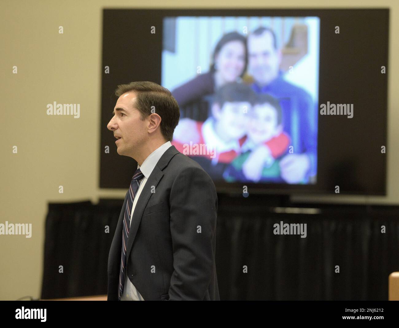 Attorney Chris Mattei shows a photograph of the Wheeler family during closing statements in the ...