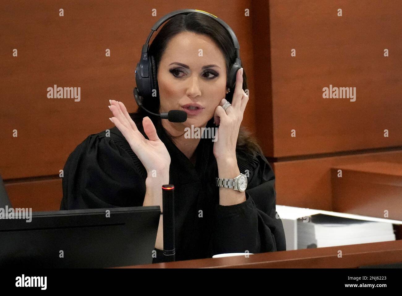 Judge Elizabeth Scherer participates in a sidebar discussion via ...