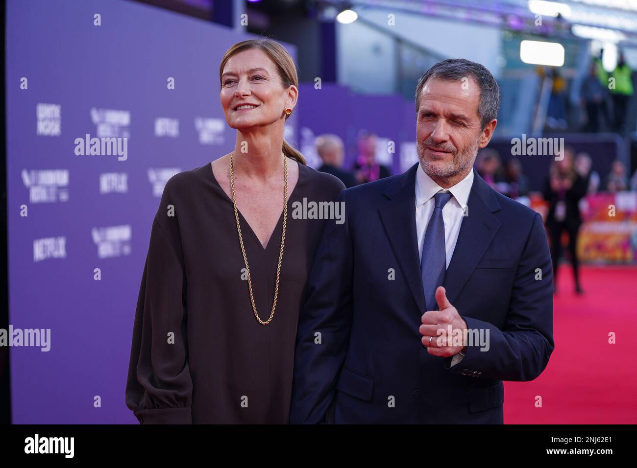 Rose Uniacke, left, and producer David Heyman pose for photographers ...