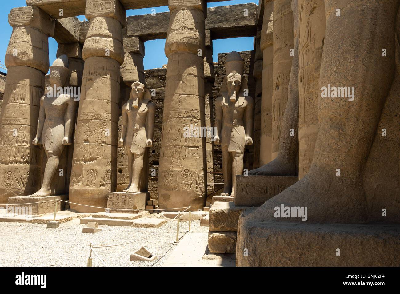 Statue of ramses in the first courtyard of luxor temple. double ...