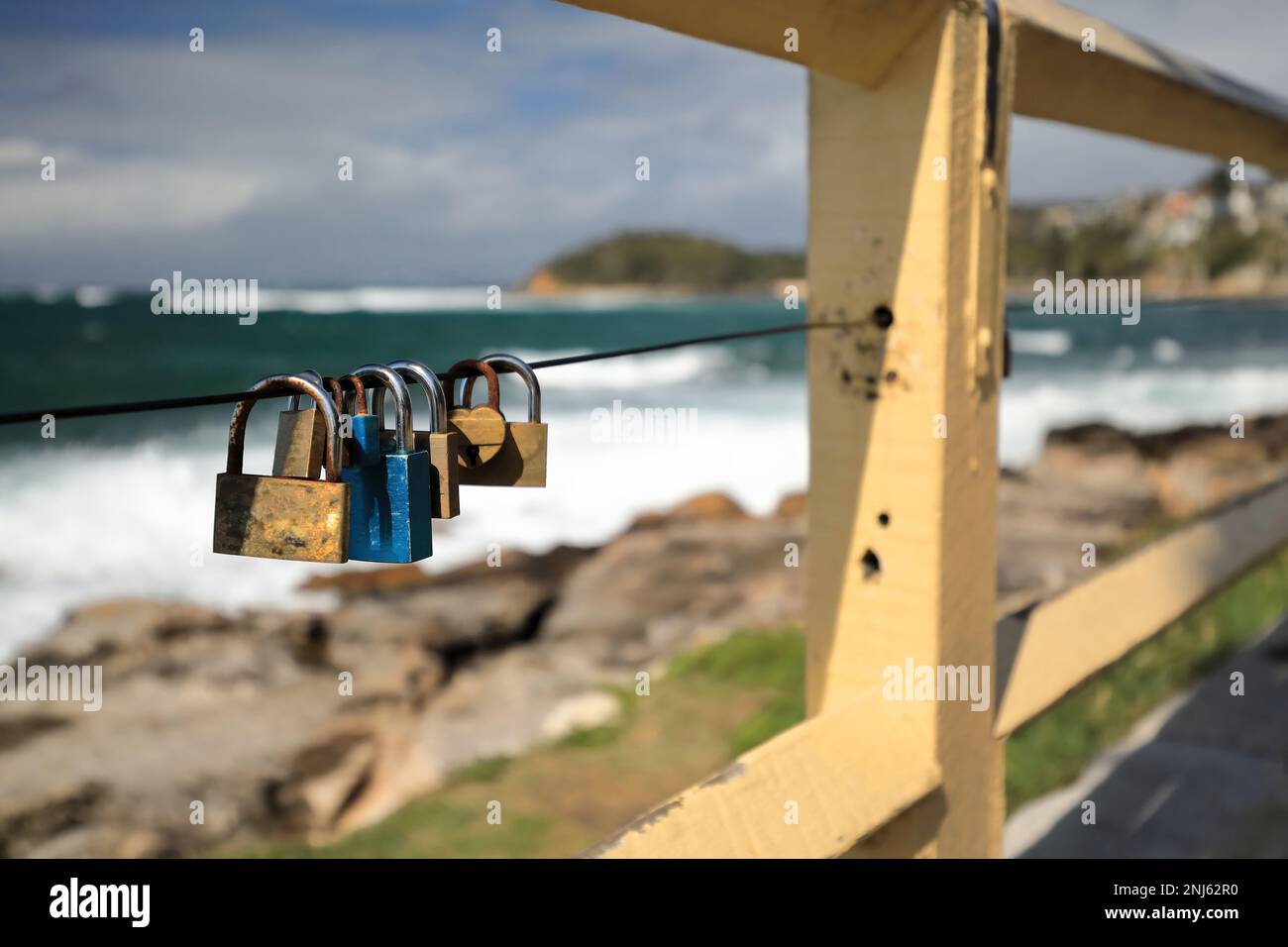 508 Love padlocks on the yellow painted railing running along the ...