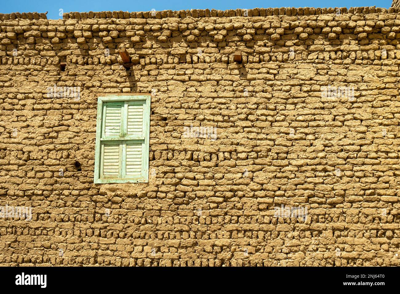 brick wall made of clay and straw. traditional construction in egypt ...