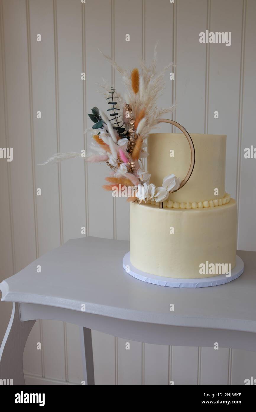 Gorgeous, simple two tier wedding cake with natural flower hoop to ...