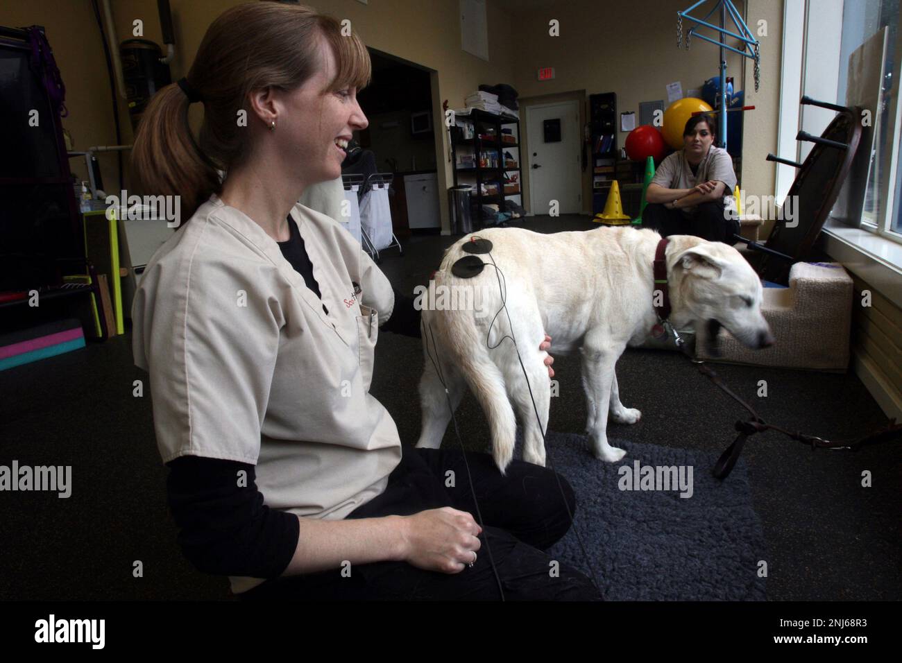 Krista Niebaum, director of rehabilitation therapy, gives Missy ...