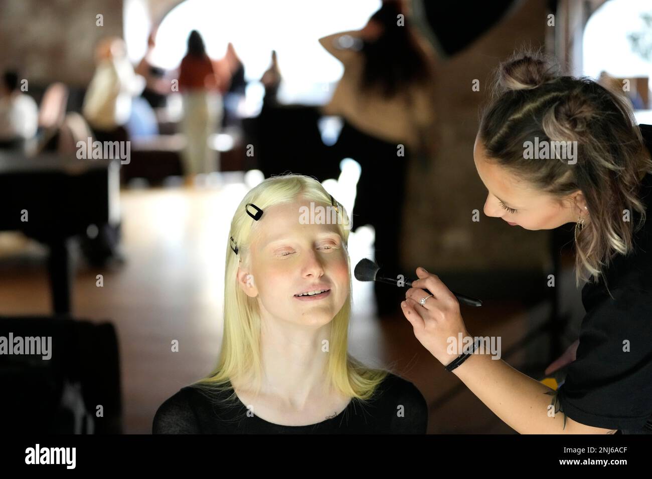 Lucia Della Ratta gets makeup during a photo shoot for "L'Imperfetta ...