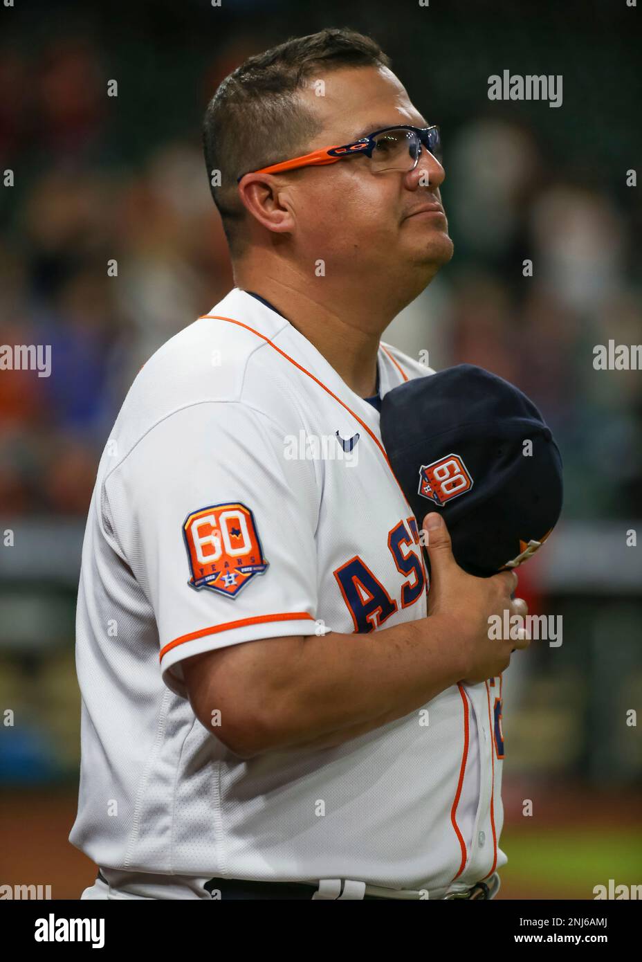 HOUSTON, TX - OCTOBER 04: Houston Astros first base coach Omar Lopez (22) stands for the singing ...
