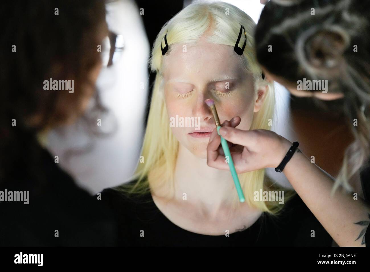 Lucia Della Ratta gets makeup during a photoshoot for the "L'Imperfetta ...