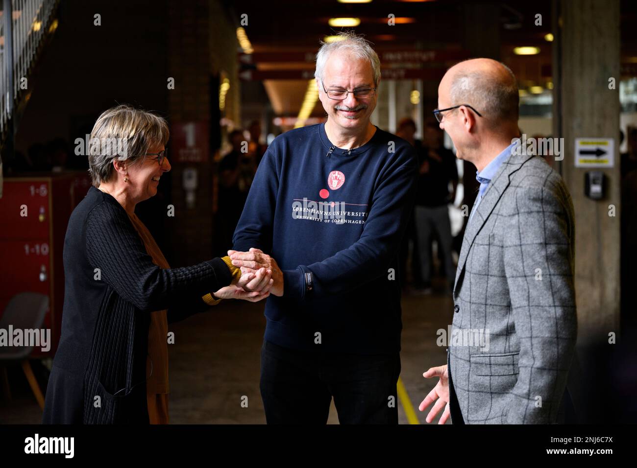 Nobel Prize in Chemistry winner Morten Meldal, center, is congratulated ...
