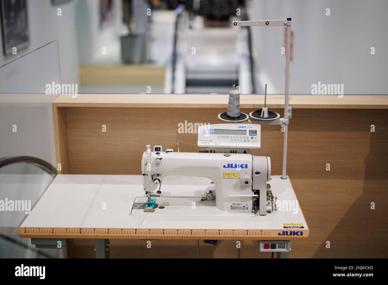 A sewing machine of the Japanese brand JUKI displayed in a Uniqlo store ...