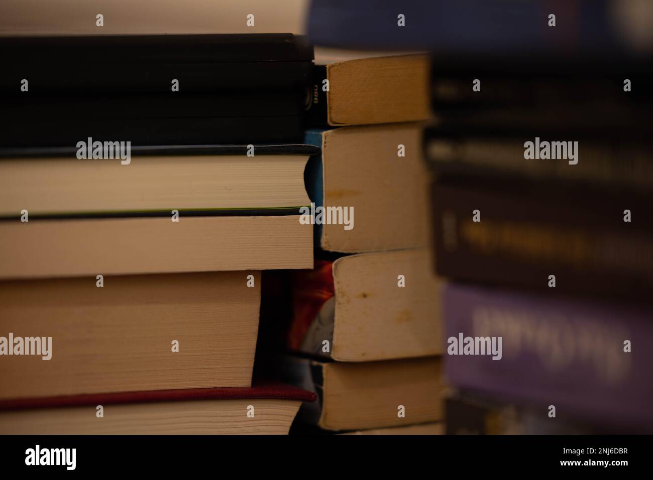 A stack of books next to each other on a table Stock Photo - Alamy