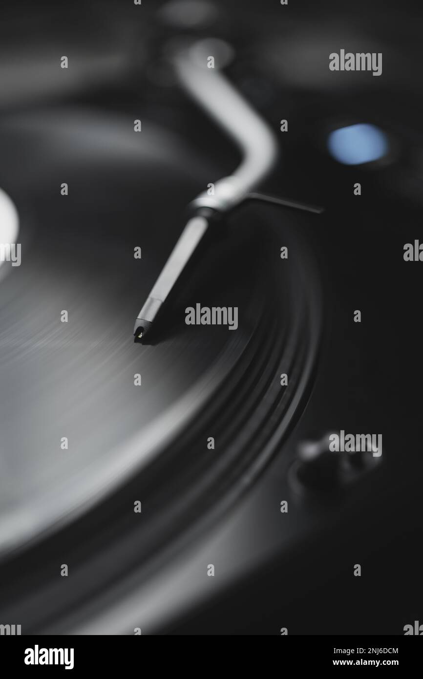 Turntables needle on vinyl record. DJ turn table player device for ...