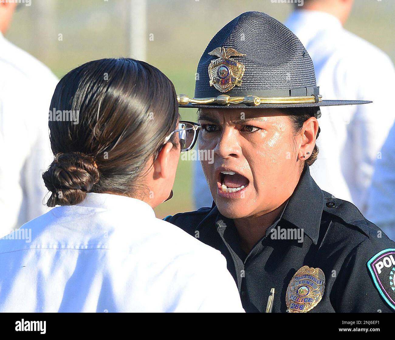 Yuma Police Department Officer Christina Fernandez, right, gets up ...