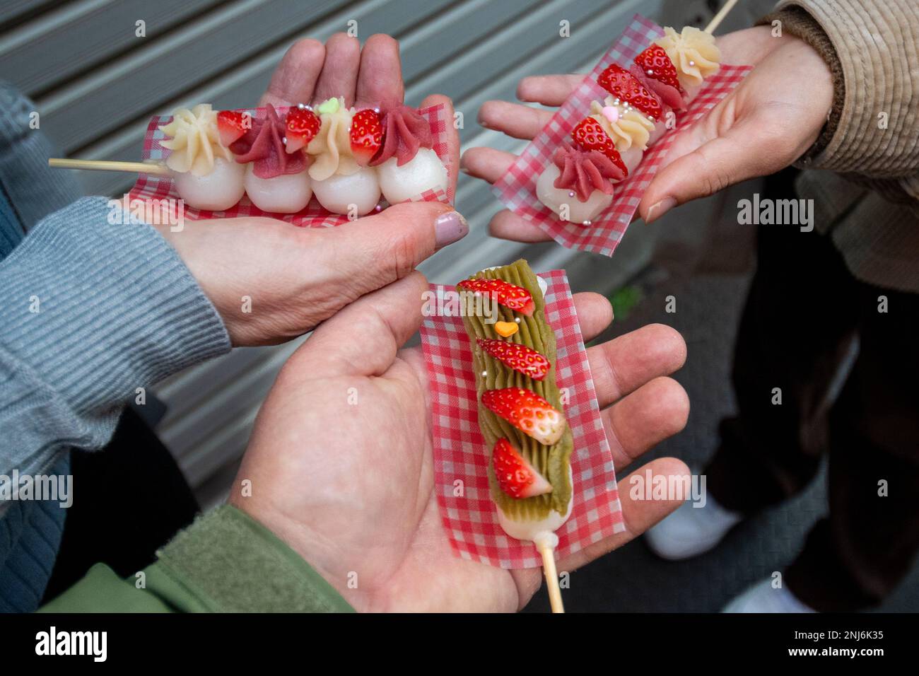 Japanese sweet strawberry, bean paste dumplings treats on sticks. Sensō ...