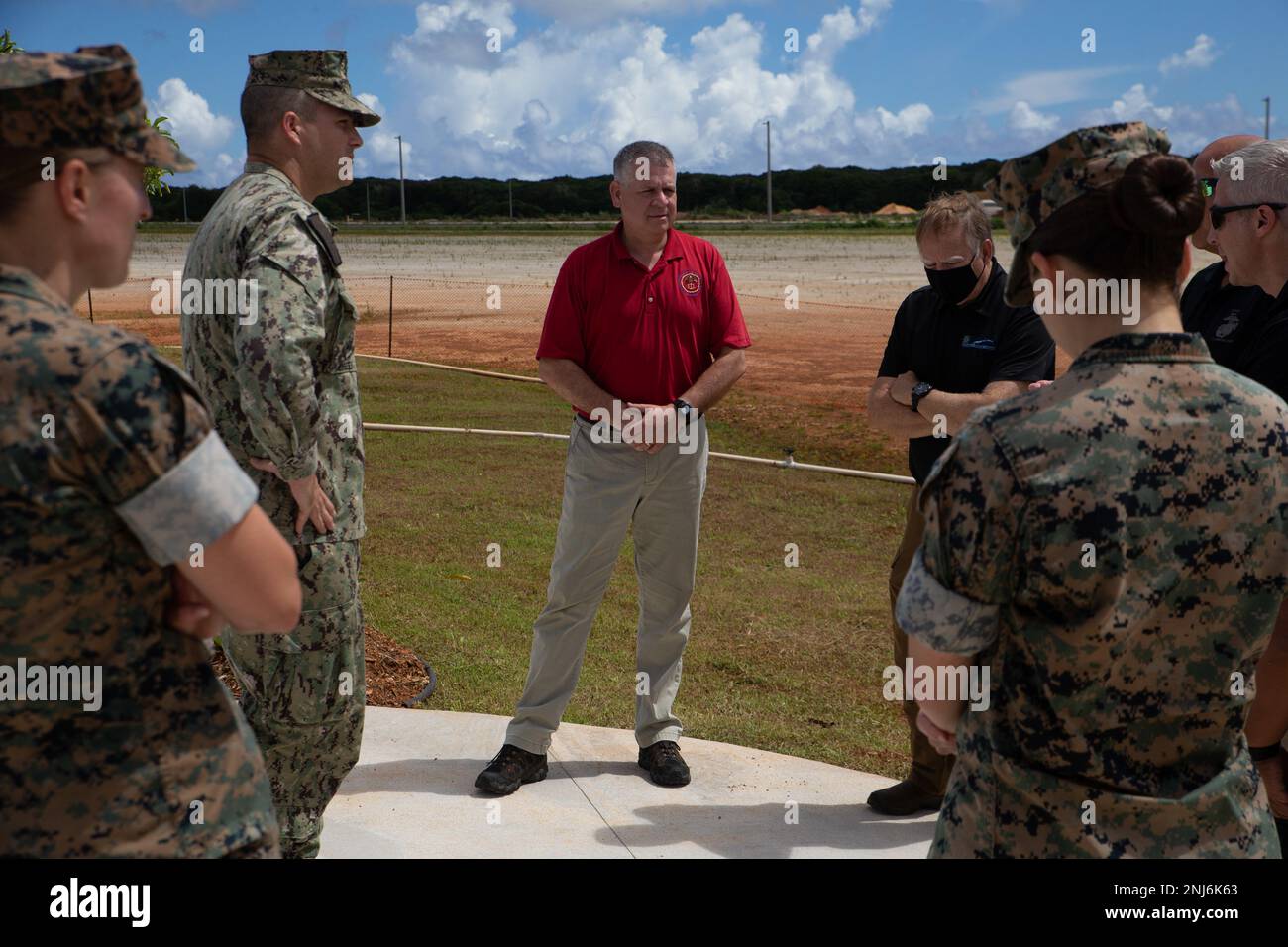 Mr. Mark Romano, counsel for the Commandant of the Marine Corps, center ...