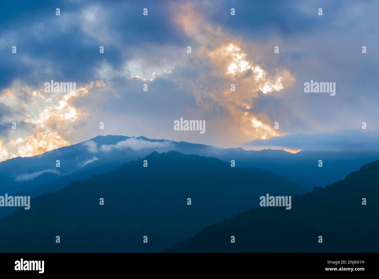 Dramatic clouds over Hiamalayan mountains after sun set, shot at Okhrey, Sikkim, India ...
