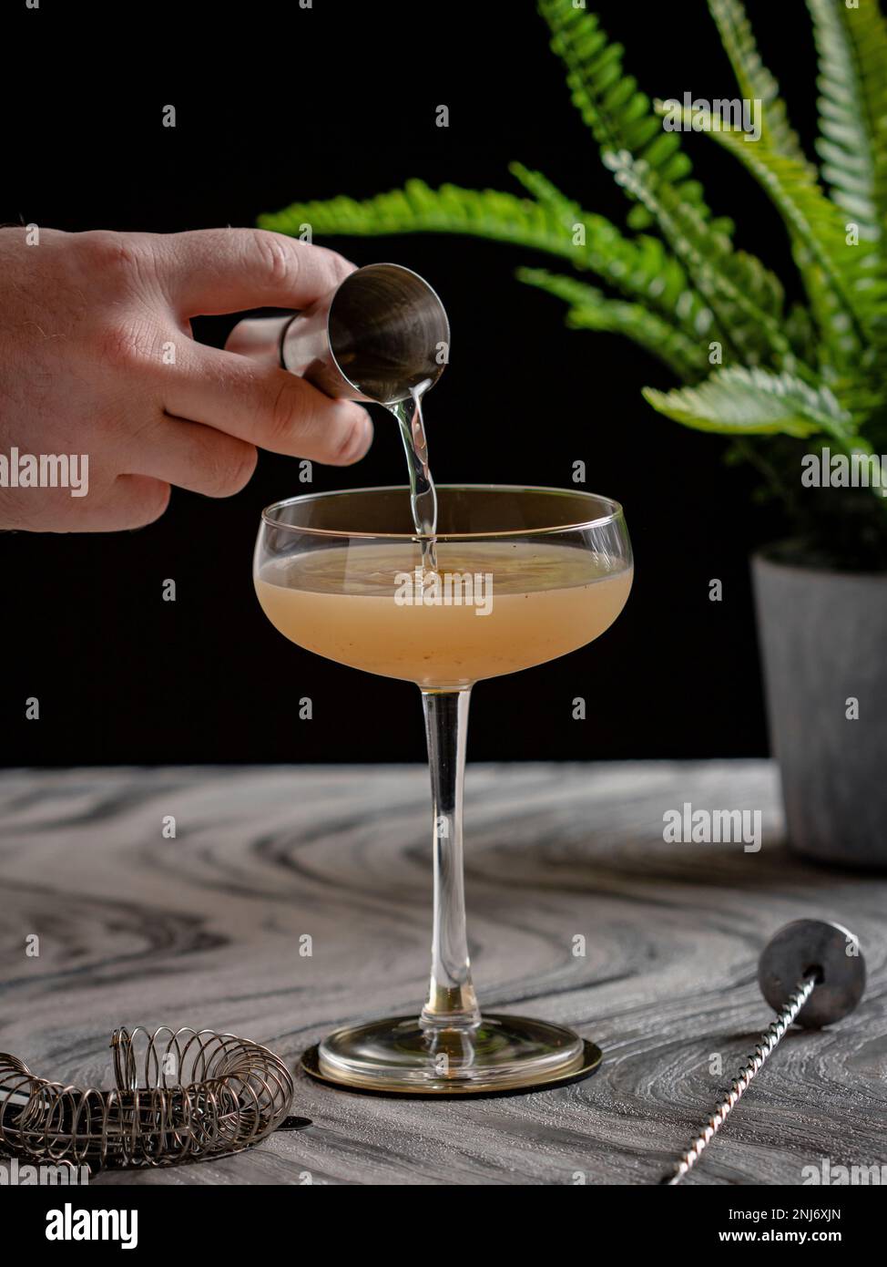 This image shows a buttered rum cocktail being prepared. (Callum Duffy ...