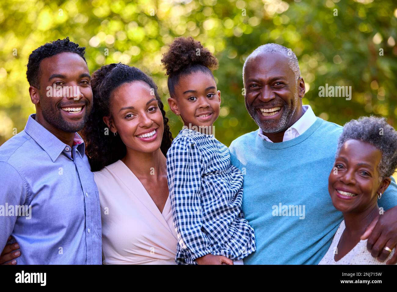 Portrait Of Multi-Generation Family Enjoying Walk In Countryside ...