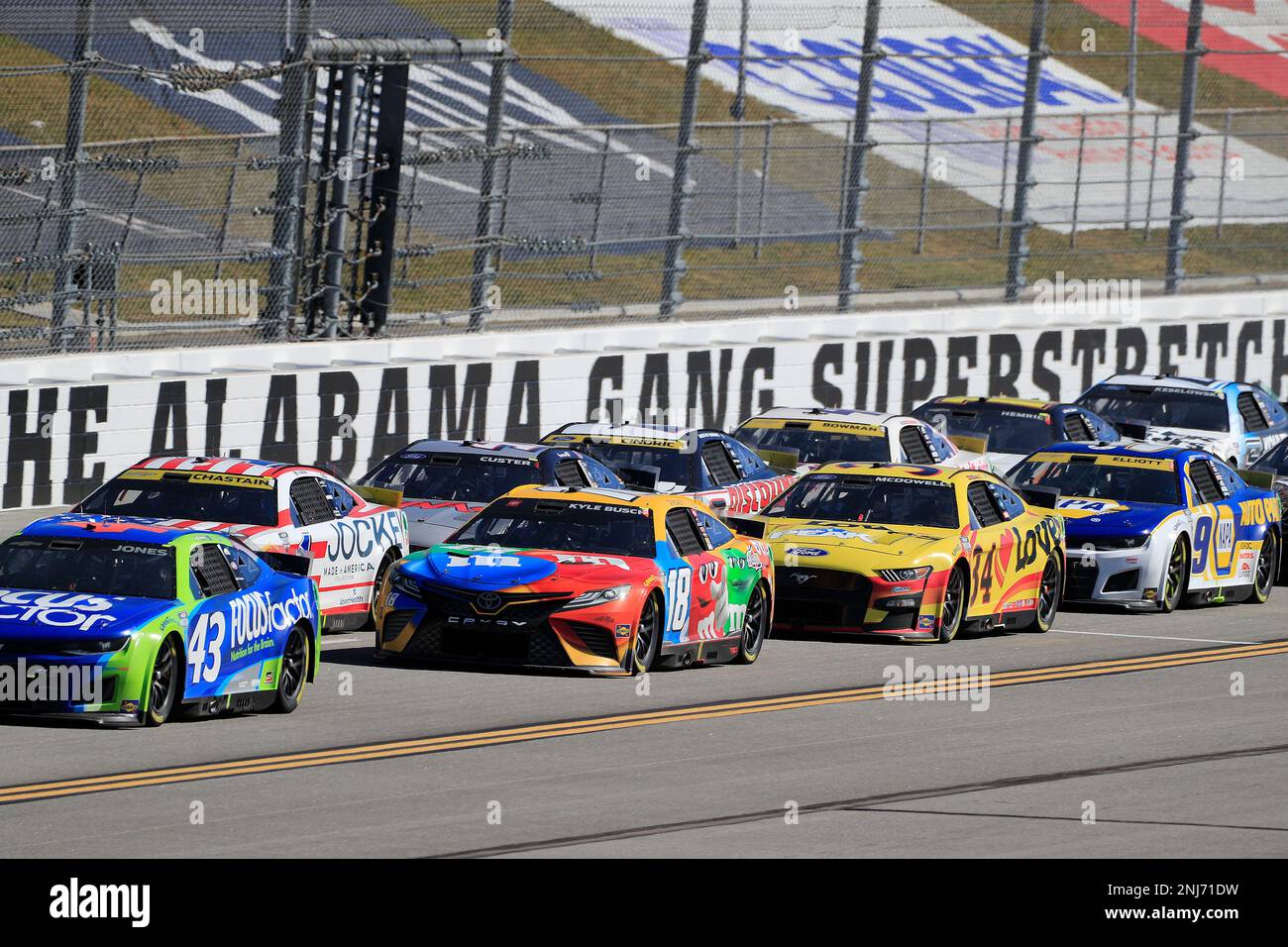 TALLADEGA, AL - OCTOBER 02: The cars race down the backstretch during the running of the ...