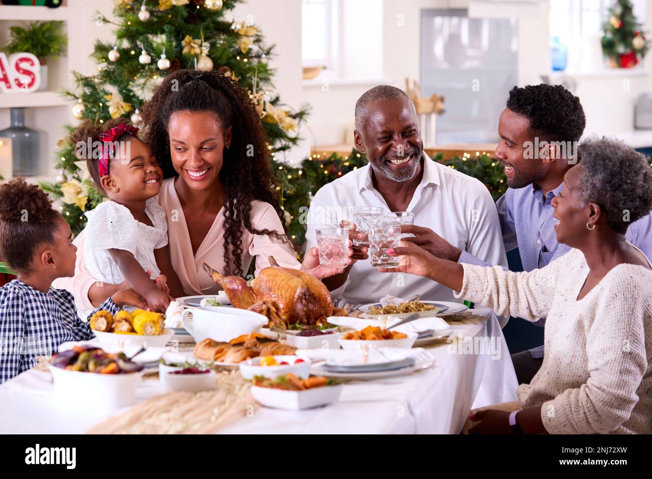 Child making dinner african american hi-res stock photography and ...