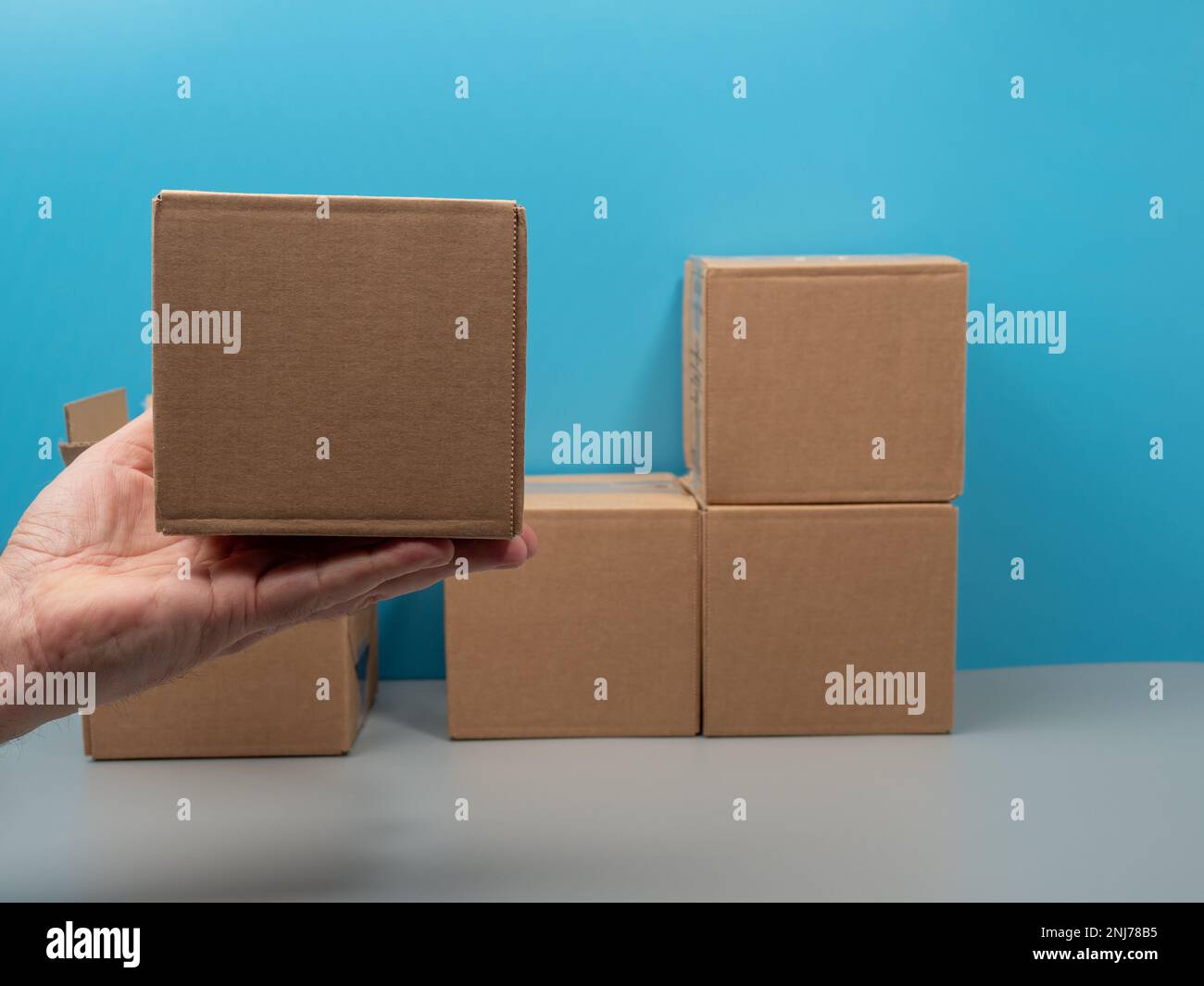 Humanitarian aid. Cardboard boxes with donations on a blue background ...
