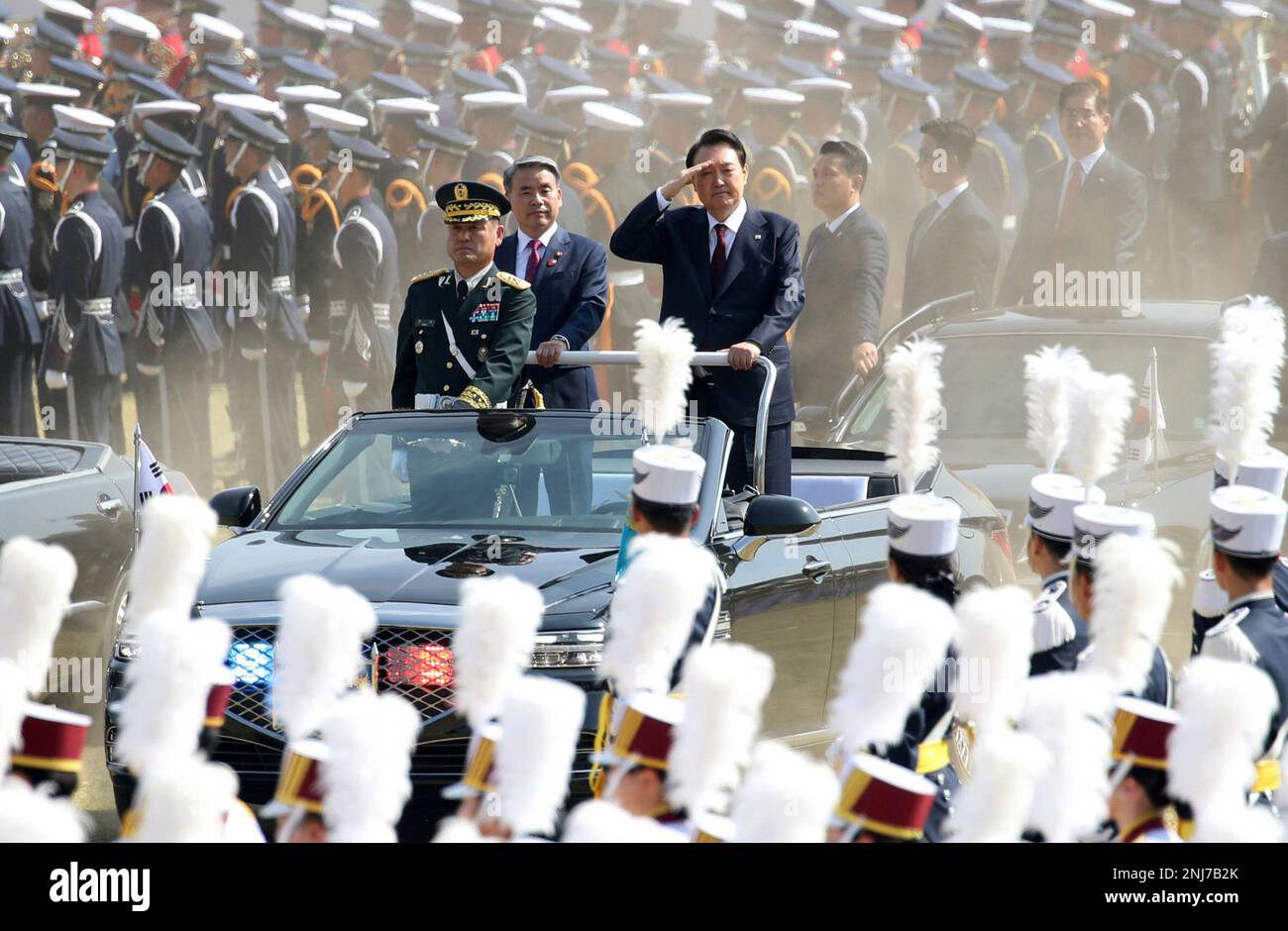 South Korean President Yoon Suk Yeol salutes as he inspects honor guard ...