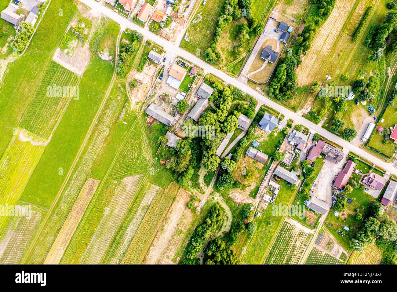 Beautiful countryside scene. Aerial view of rural road, agribusiness ...