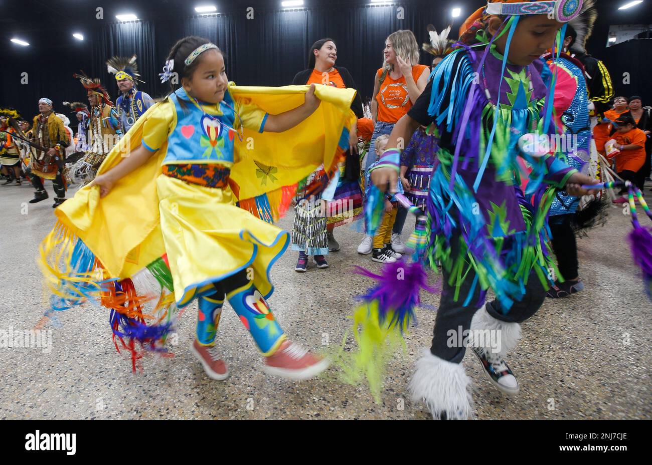 Hannah Lavallee, 6, and brother Tyee, 8, dance during the grand ...