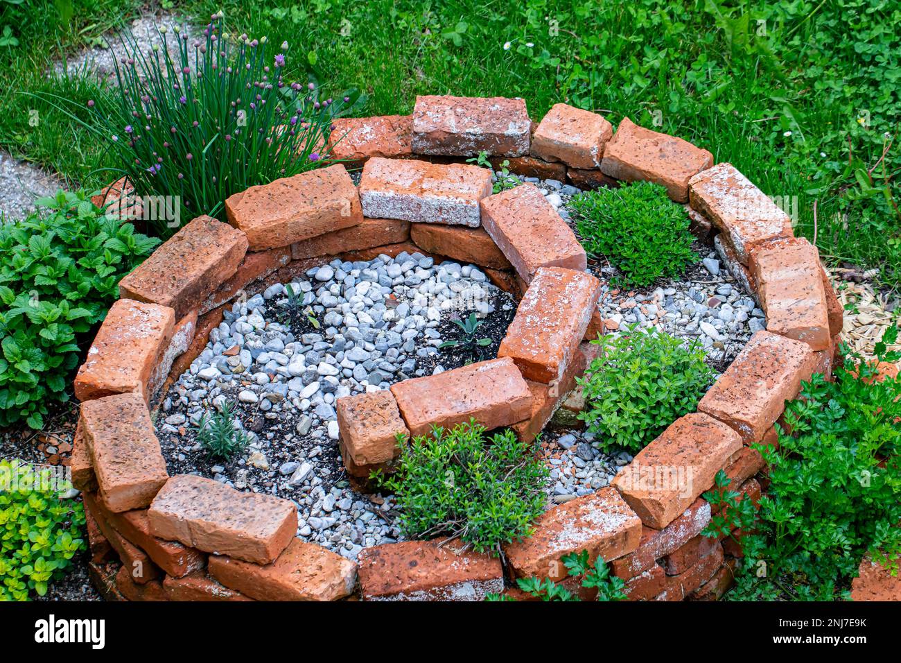 Brick circle for herbal garden Stock Photo - Alamy