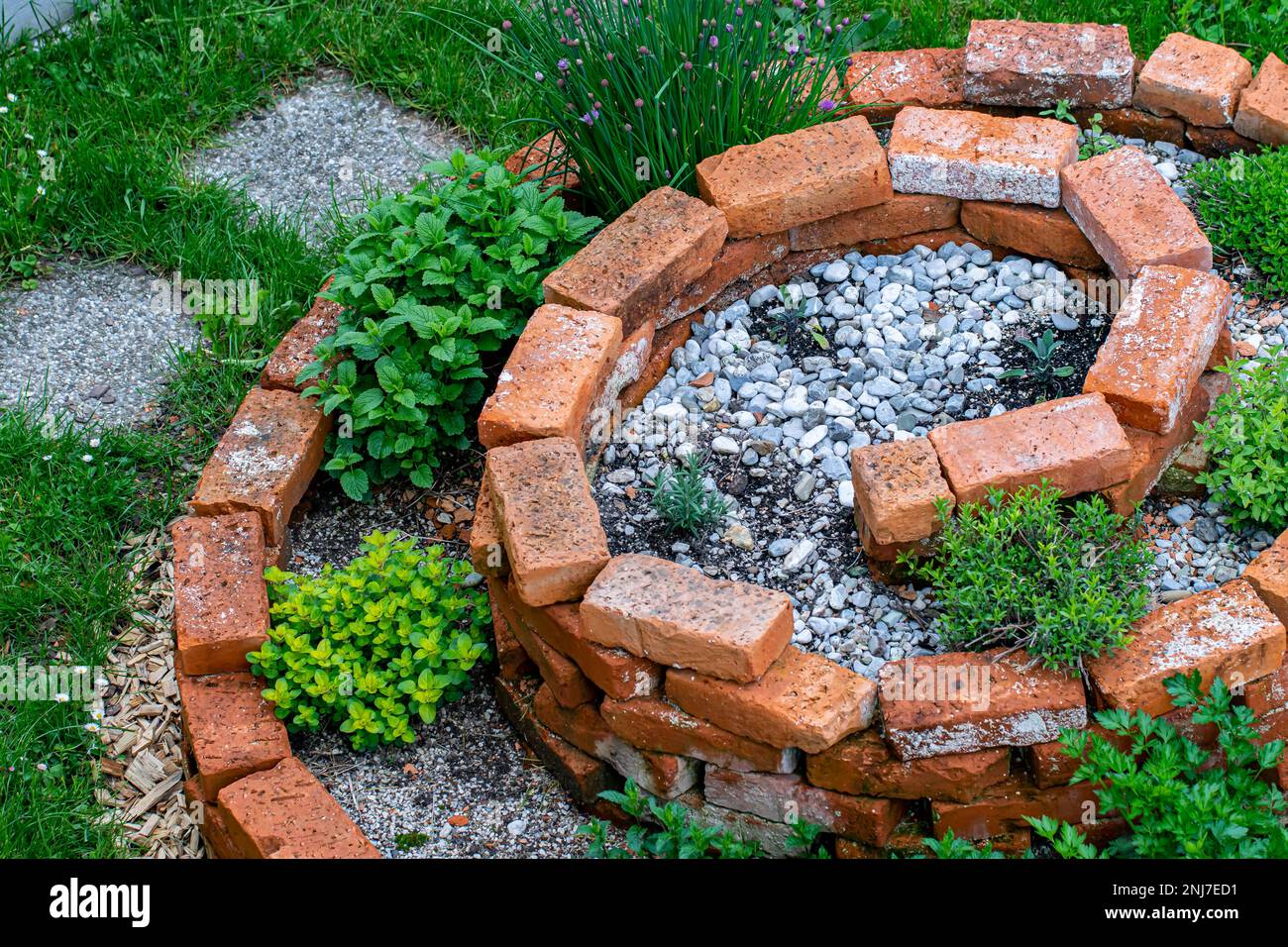 Brick circle for herbal garden Stock Photo - Alamy
