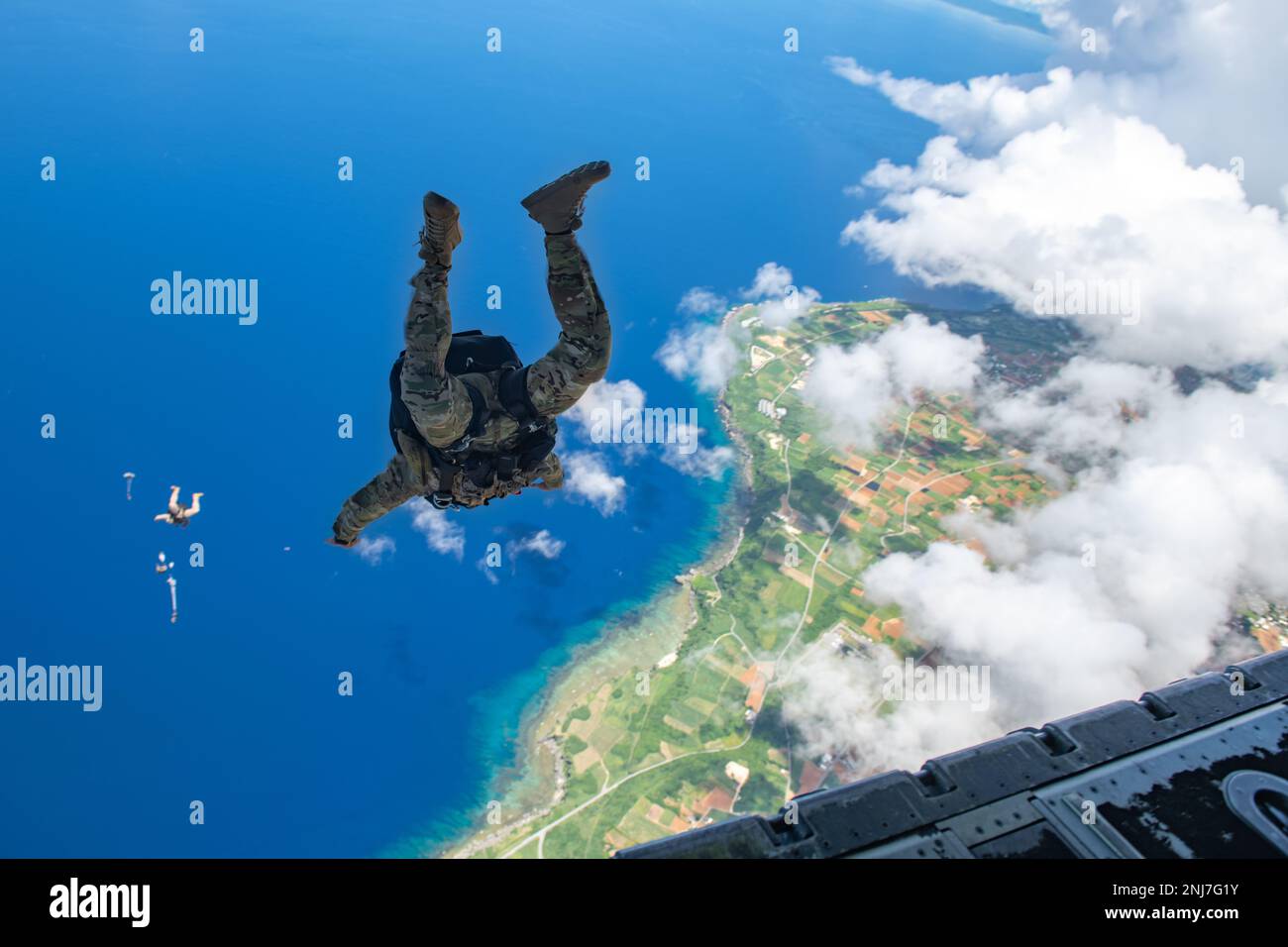 A U.S. Navy sailor jumps out the back of a 1st Special Operations ...