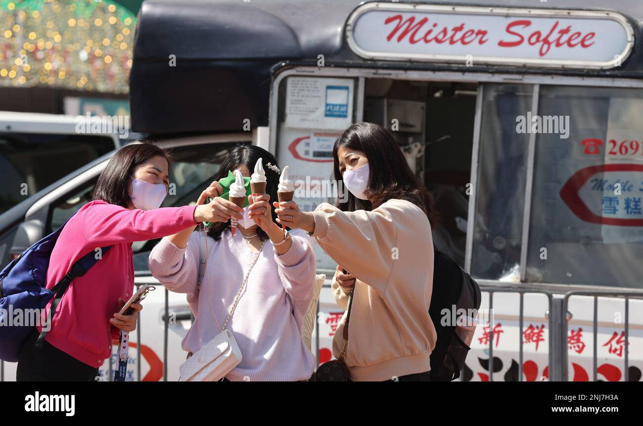 People take picture with ice cream beside a Mister Softee ice-cream van ...