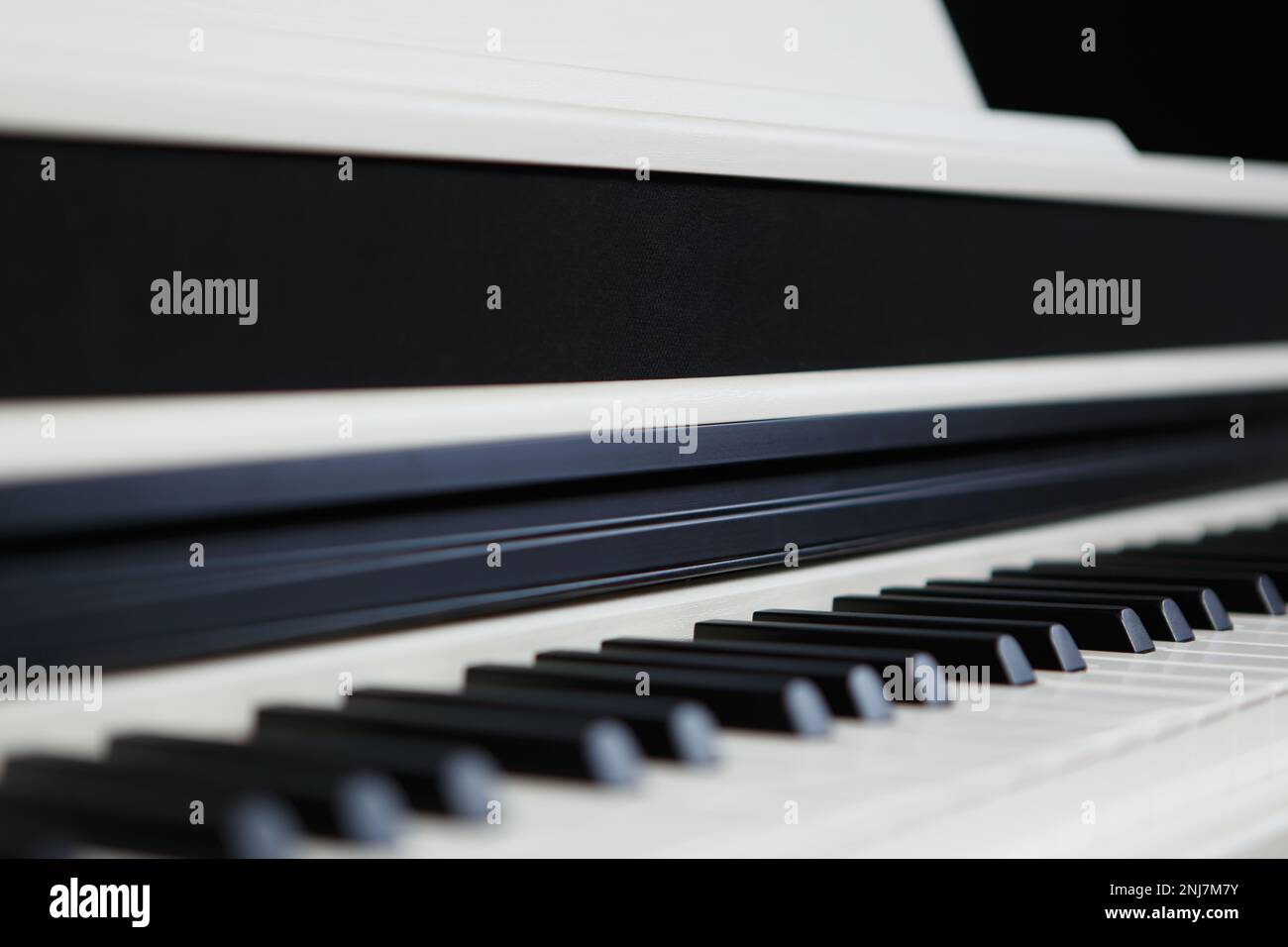 Modern white syntesizer piano. Professional high end musical instrument ...