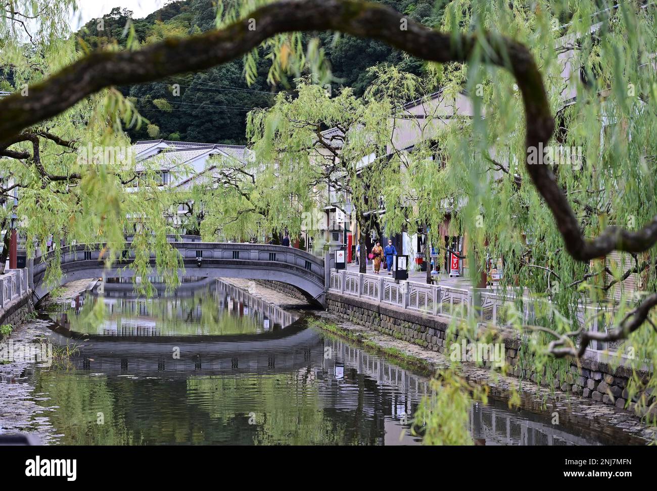 A photo shows a bridge over Ohtani River at Kinosaki Onsen (hot spring ...