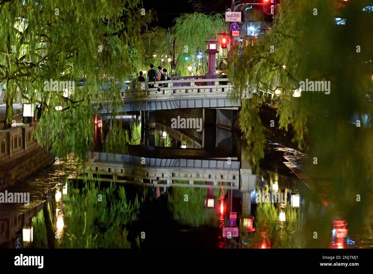A photo shows a bridge over Ohtani River at Kinosaki Onsen (hot spring ...