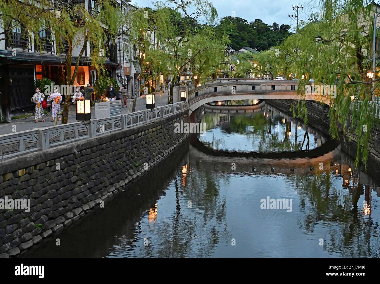 A photo shows a bridge over Ohtani River at Kinosaki Onsen (hot spring ...