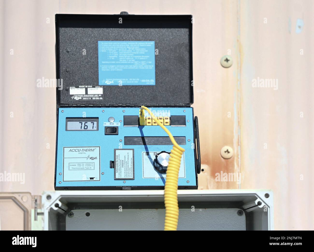 A temperature gauge represents the temperature of a burn structure mid ...