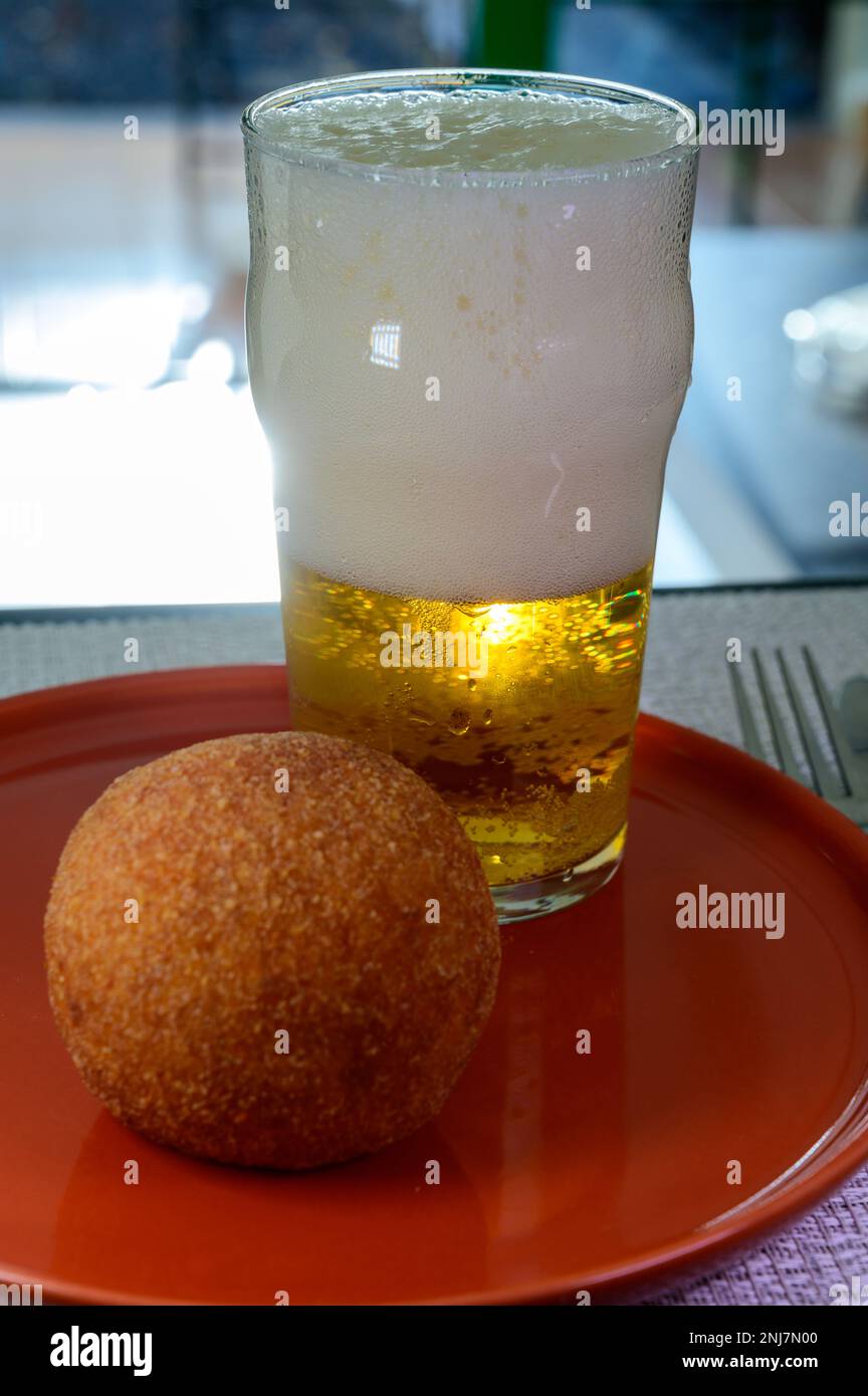 Traditional street food in Scotland, glass of fresh lager beer and ...