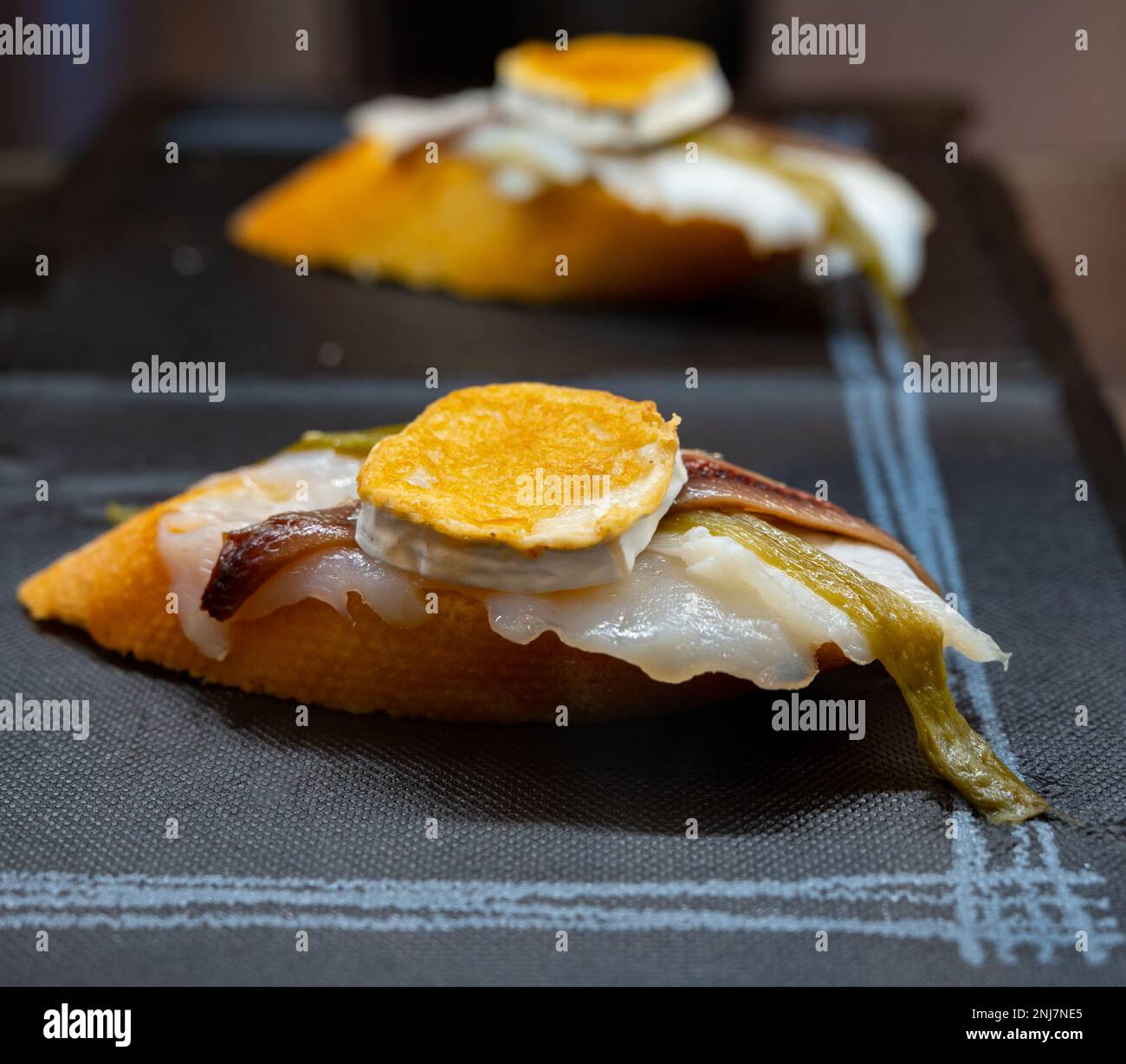 Typical snack of Basque Country, pinchos or pinxtos, small piece of ...