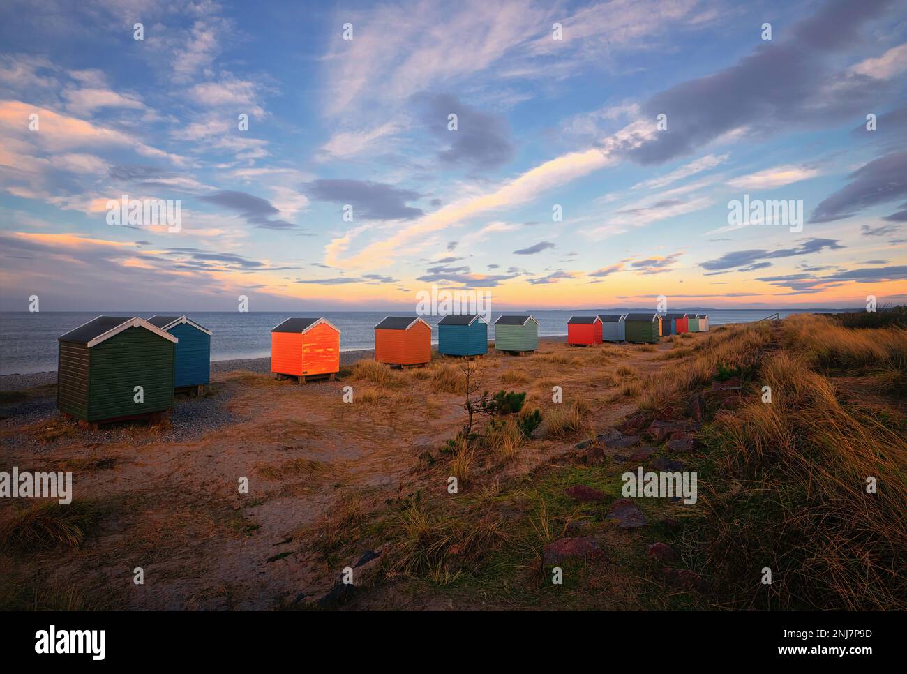 The colourful beach huts at Findhorn under a beautiful big sky Stock ...