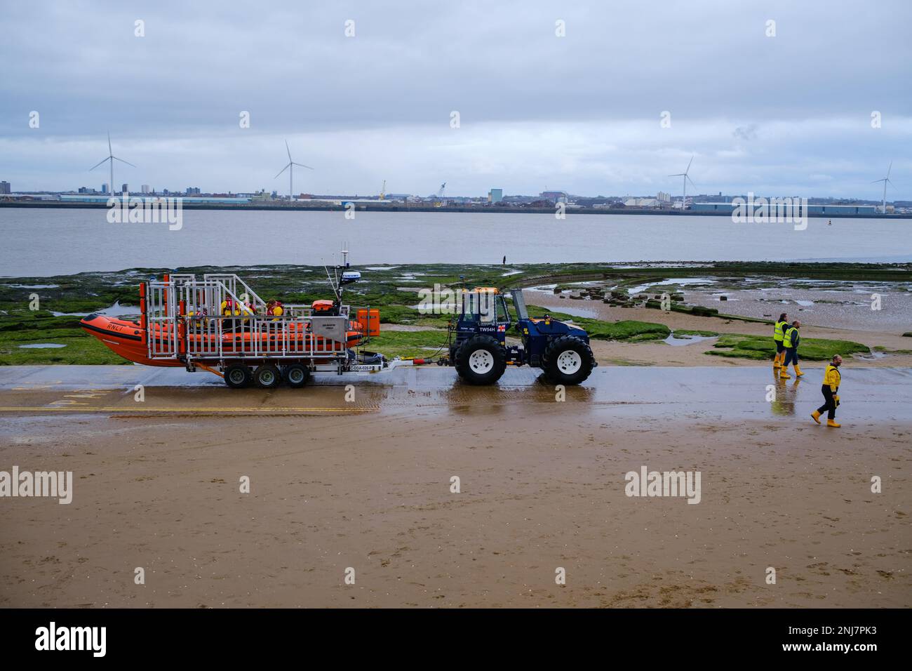 New Brighton life boat crew recovering the boat back up the beach with ...