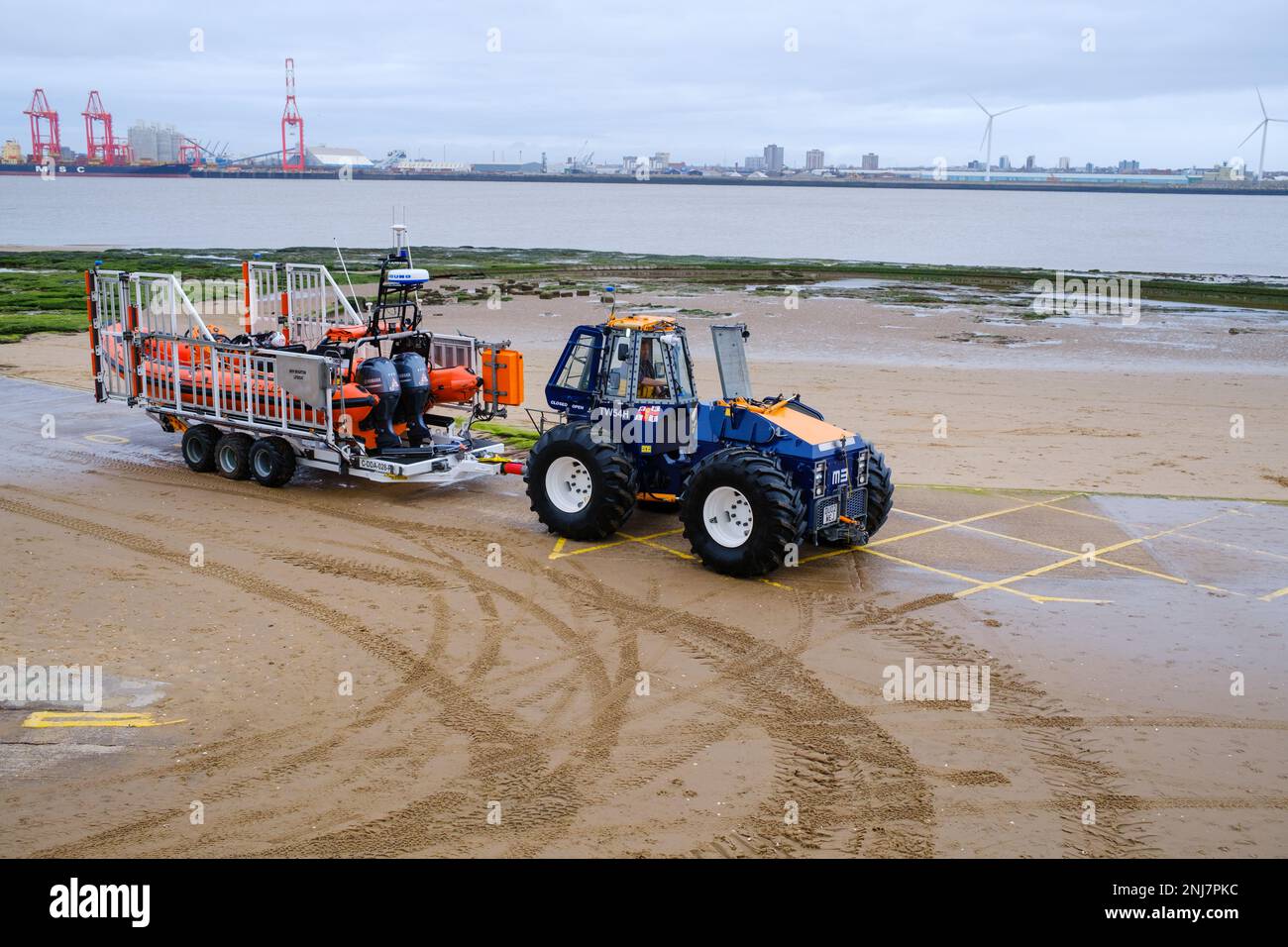 New Brighton life boat crew recovering the boat back up the beach with ...