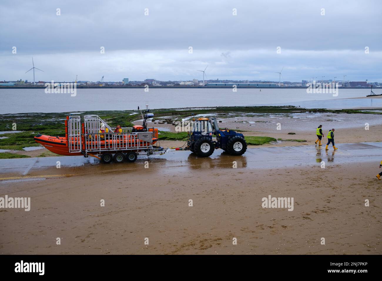 New Brighton life boat crew recovering the boat back up the beach with ...